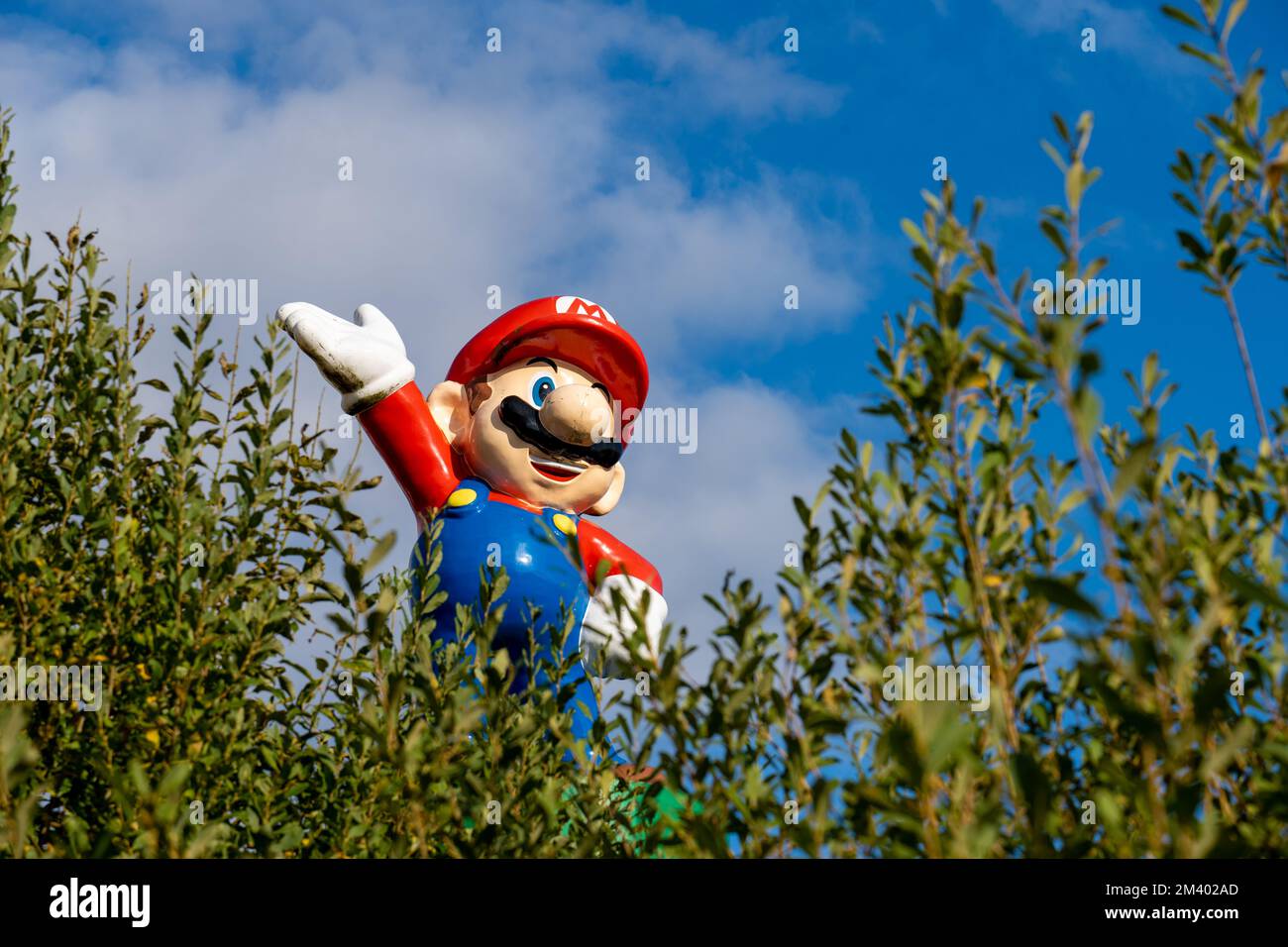 Kungsbacka, Sweden - september 11 2022: Mario statue on top of a green ...