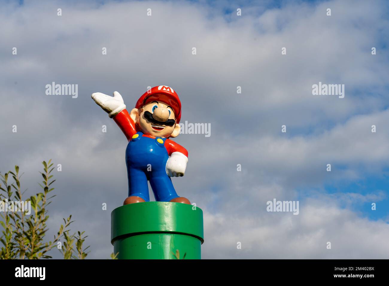 Kungsbacka, Sweden - september 11 2022: Mario statue on top of a green ...