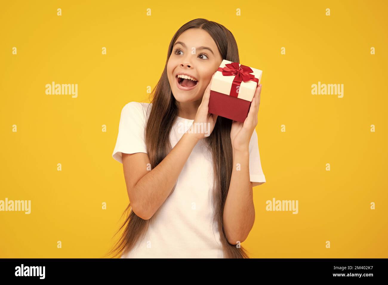 Teenager kid with present box. Teen girl giving birthday gift. Present ...