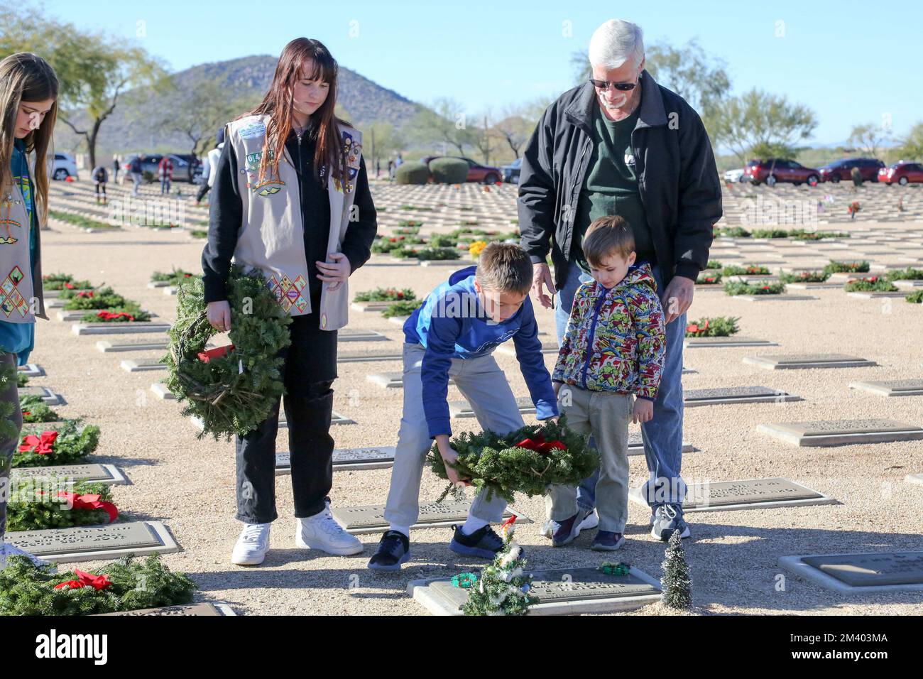 Family members and friends of veterans lay wreaths at the annual ...
