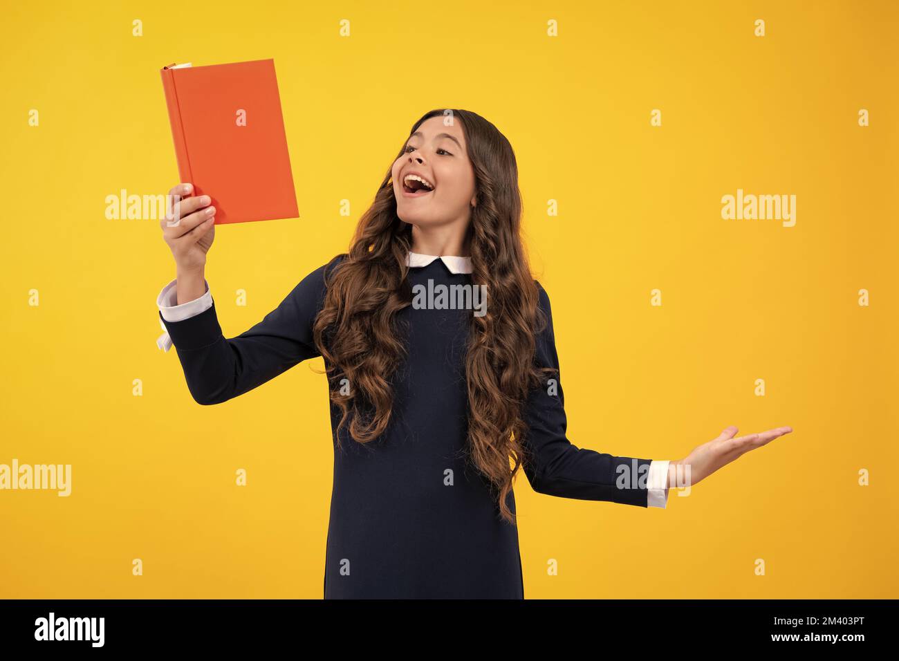 Excited face. Schoolgirl with copy book posing on isolated background ...