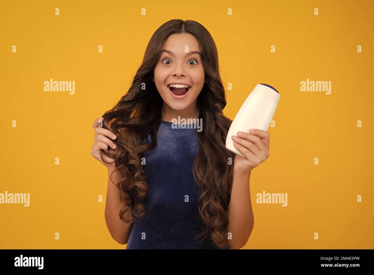 Teenager child girl with bottle shampoo conditioners or shower gel ...