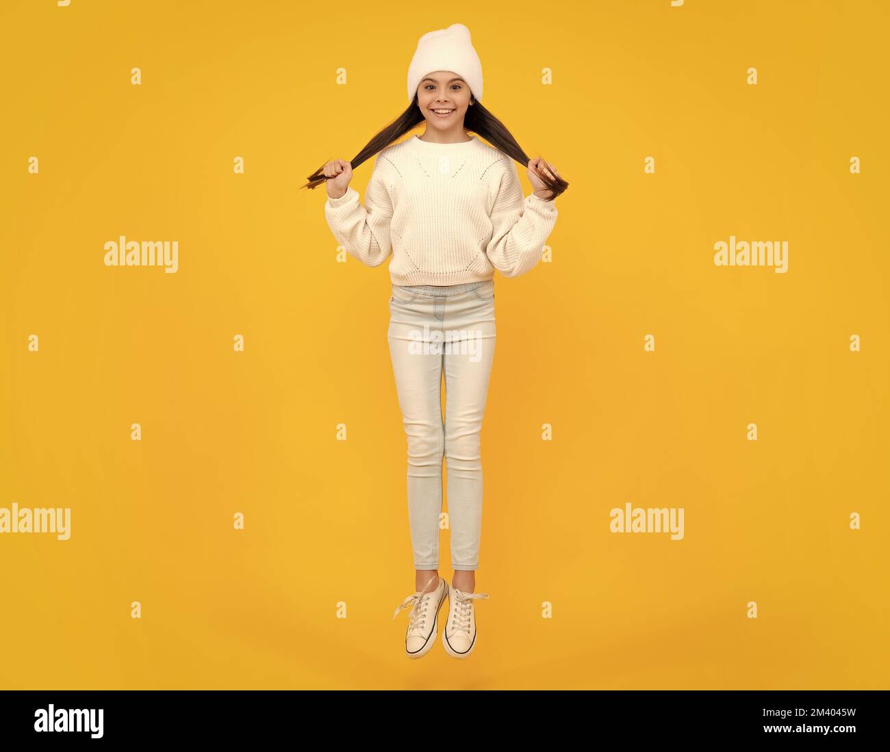 Happiness, activity and child. Teenager girl jumping on isolated ...