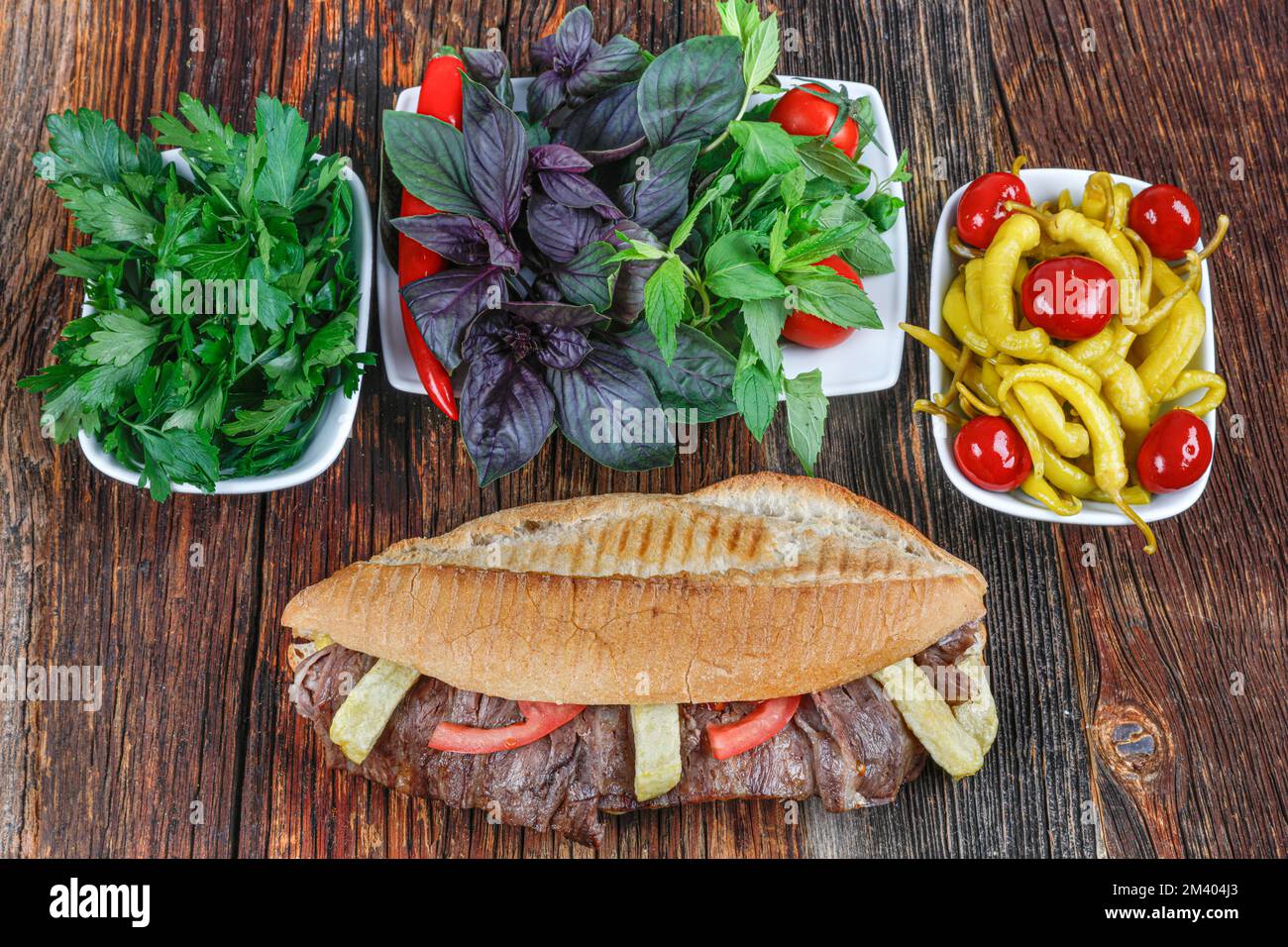 Doner bread, beef doner kebab with pickled peppers on wooden table ...