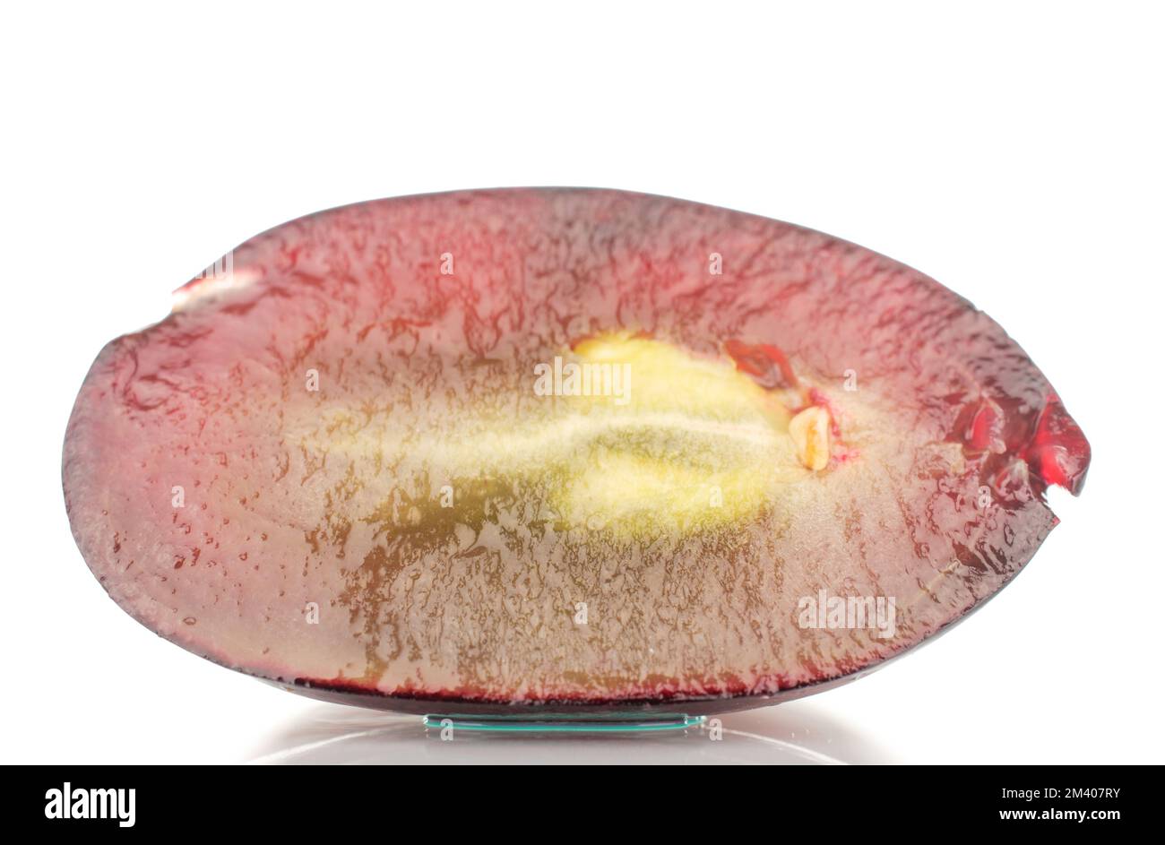 One half of a black grape berry, close-up, isolated on white Stock ...