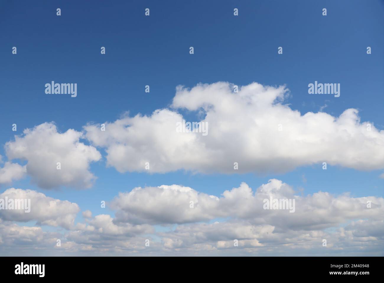 Blue sky background with white fluffy clouds in daytime outdoors ...