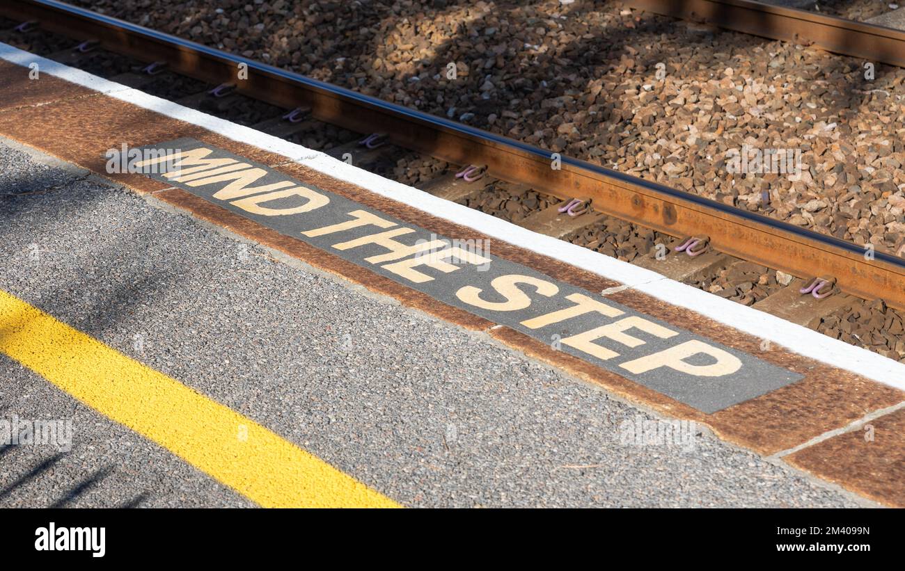 Mind the Step Warning Sign Phrase on a Railway Platform at a Train ...