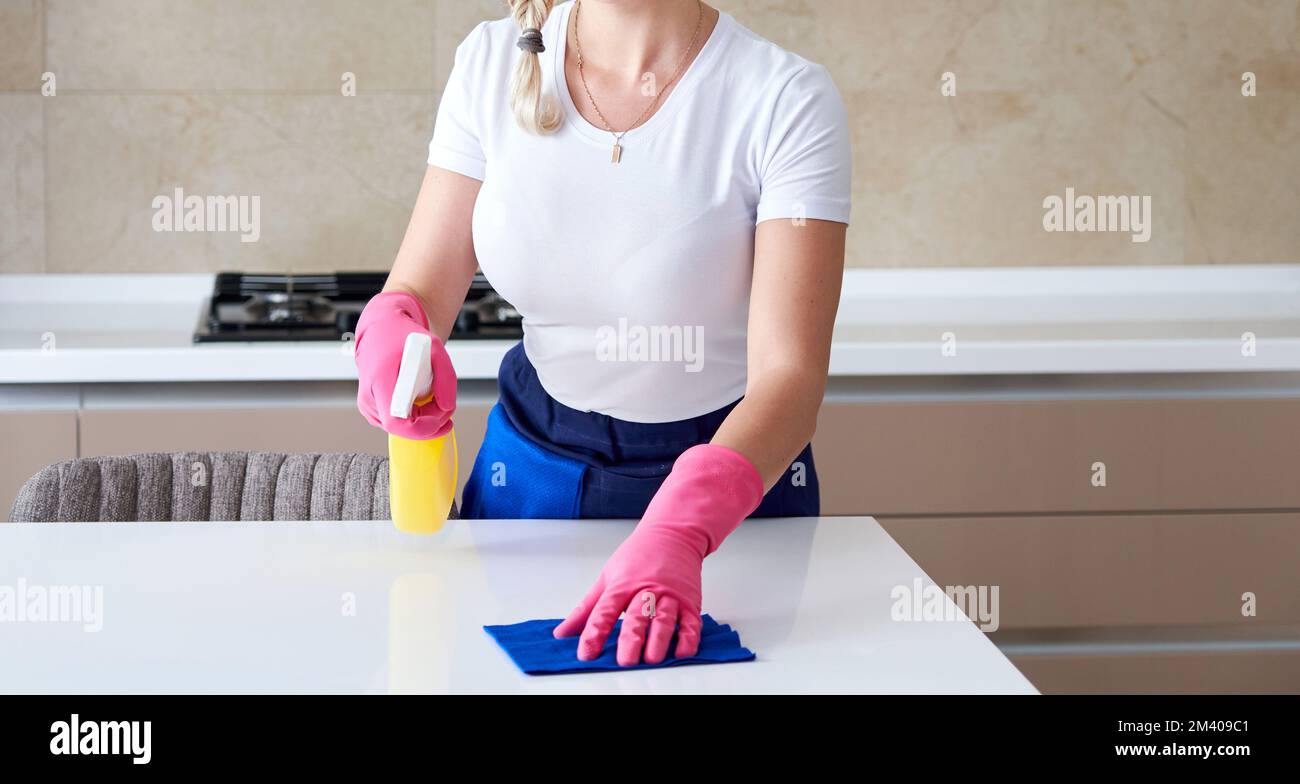 Cleaning home table sanitizing kitchen table surface with disinfectant ...