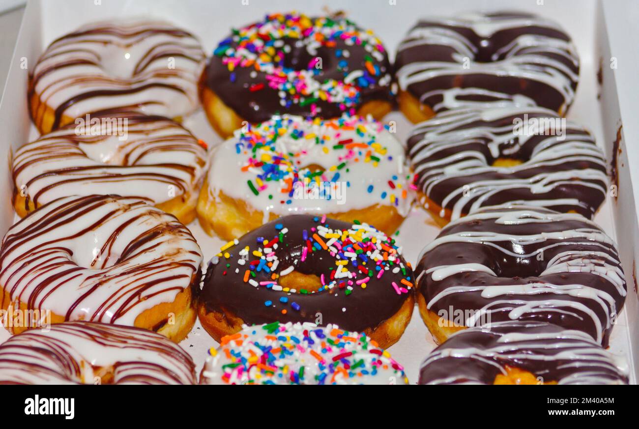 dozen donuts of different flavors, colors and textures Stock Photo - Alamy