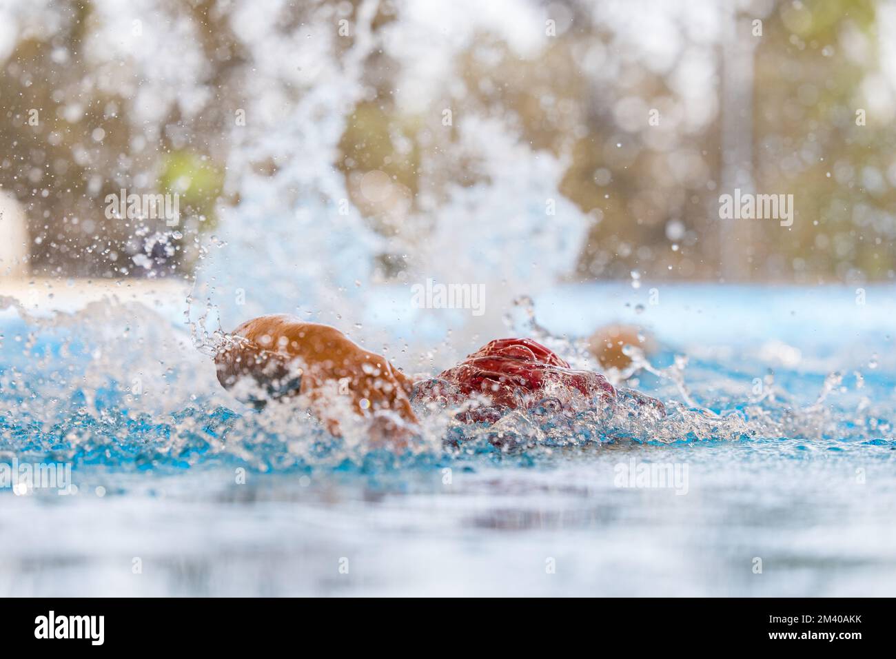 A water splash while a person swimming in pool Stock Photo - Alamy