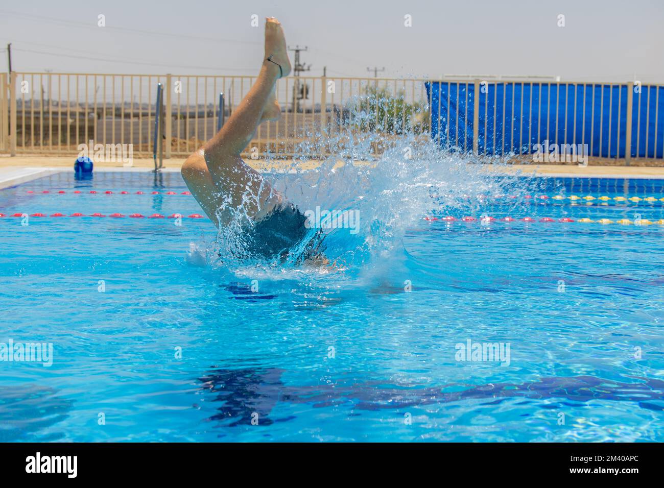 Legs jumping into a pool hi-res stock photography and images - Alamy