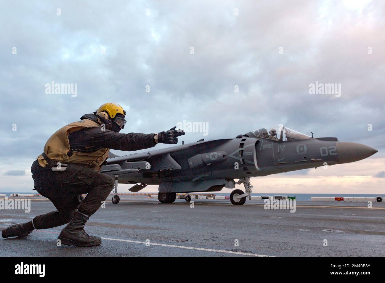 Norfolk, United States. 06th Dec, 2022. A U.S. Navy yellow vest signals ...