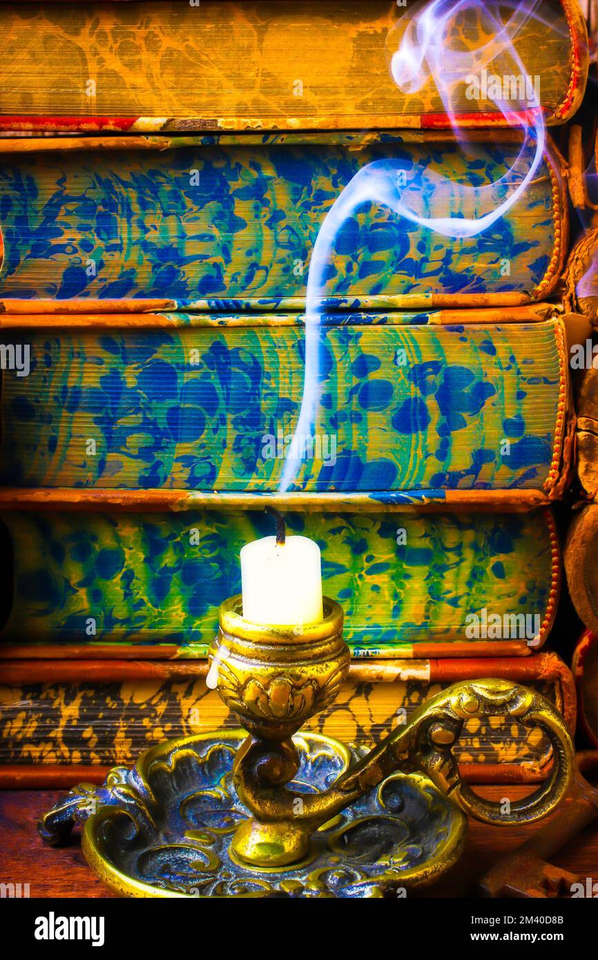 Stacked books and candle hi-res stock photography and images - Alamy