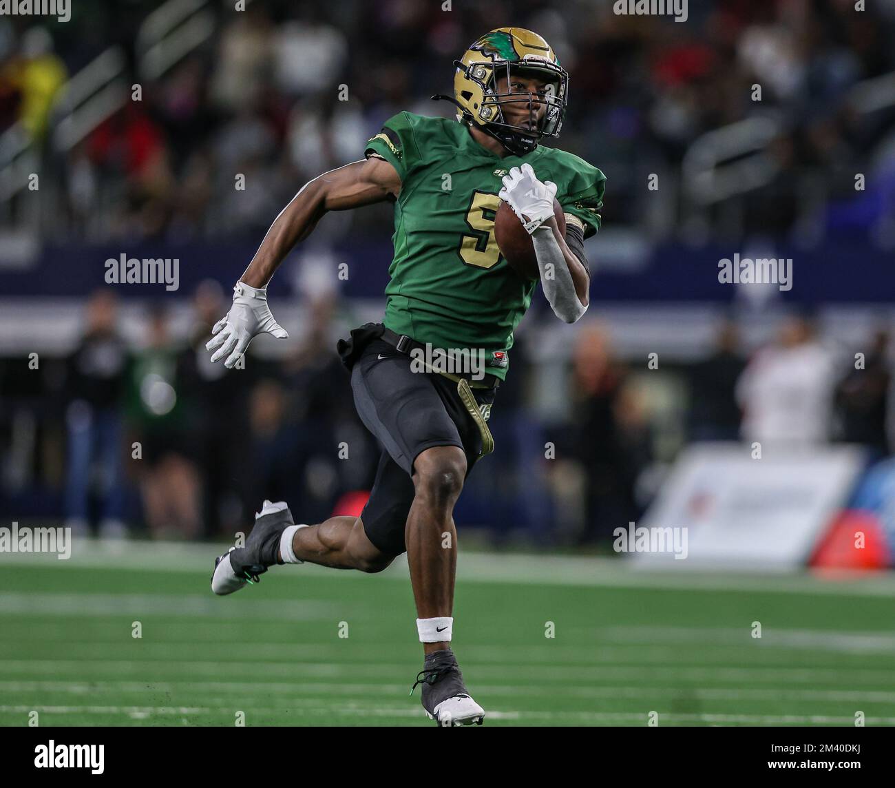 Dallas, TX, USA. 17th Dec, 2022. DeSoto's Tre Wisner #5 takes off for a ...