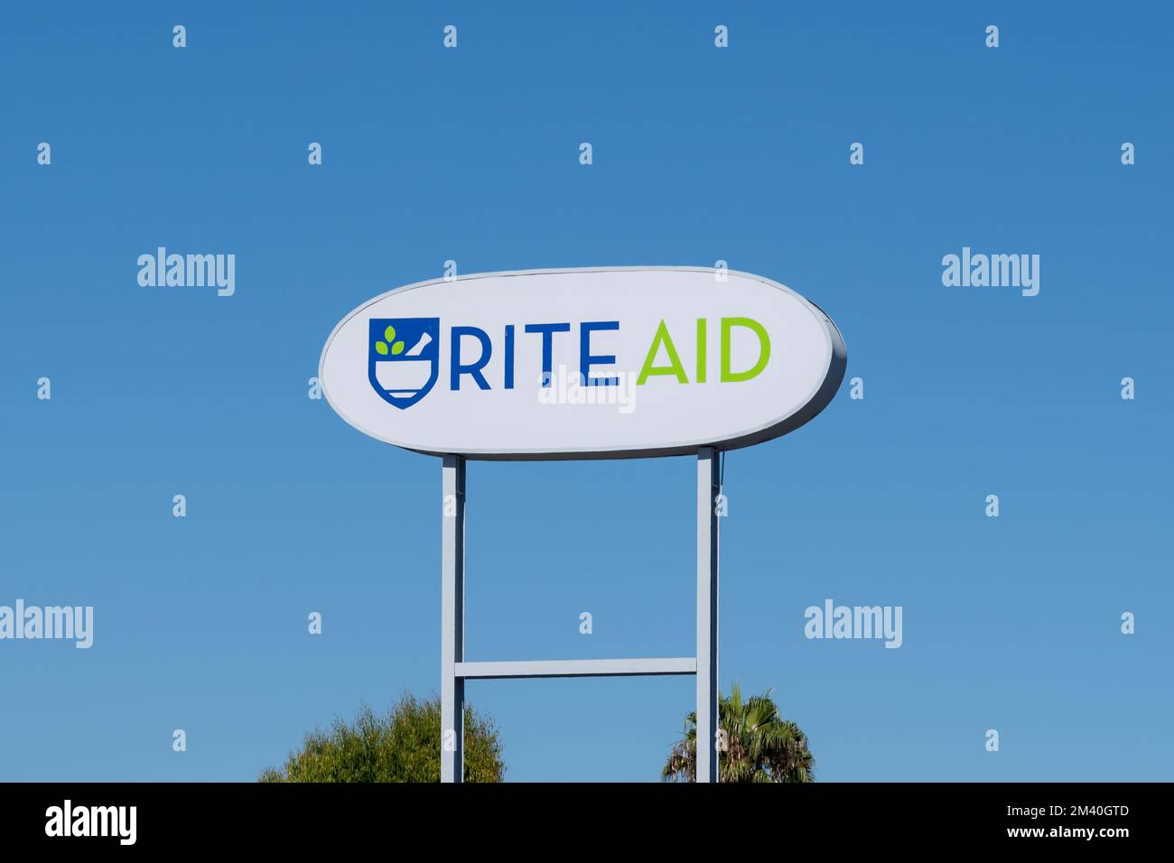 A Rite Aid pole sign with blue sky in background Stock Photo - Alamy