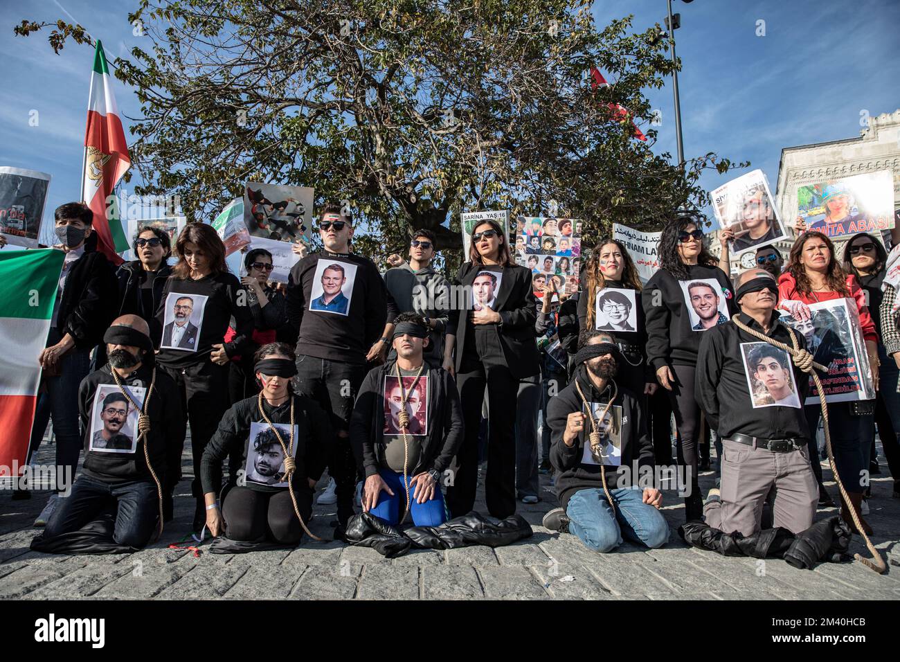 Istanbul, Turkey. 17th Dec, 2022. Protesters perform an execution scene ...