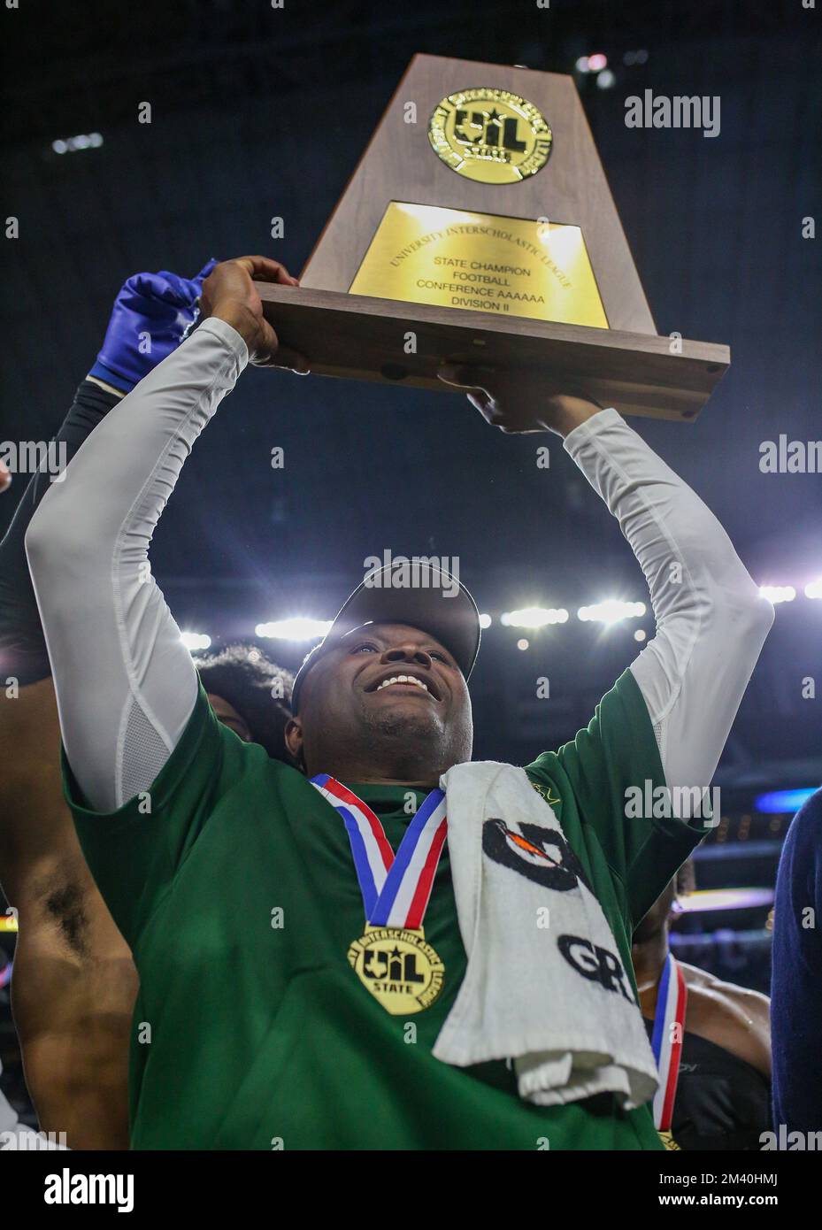 December 17, 2022: DeSoto High School head coach Claude Mathis holds up ...