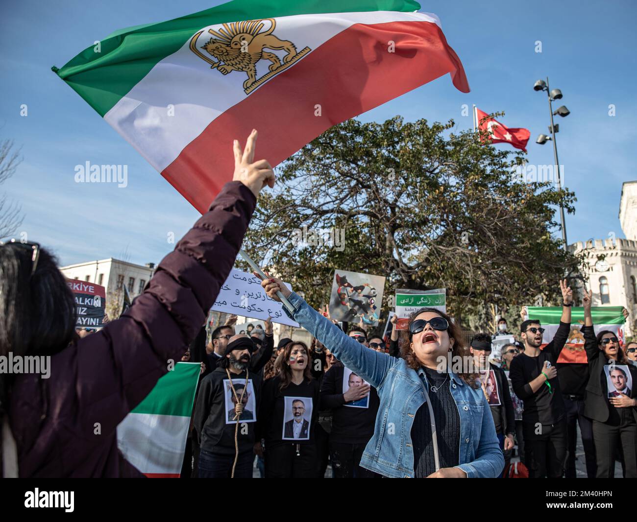 A protester waves the Iranian flag during the demonstration. Mahsa ...