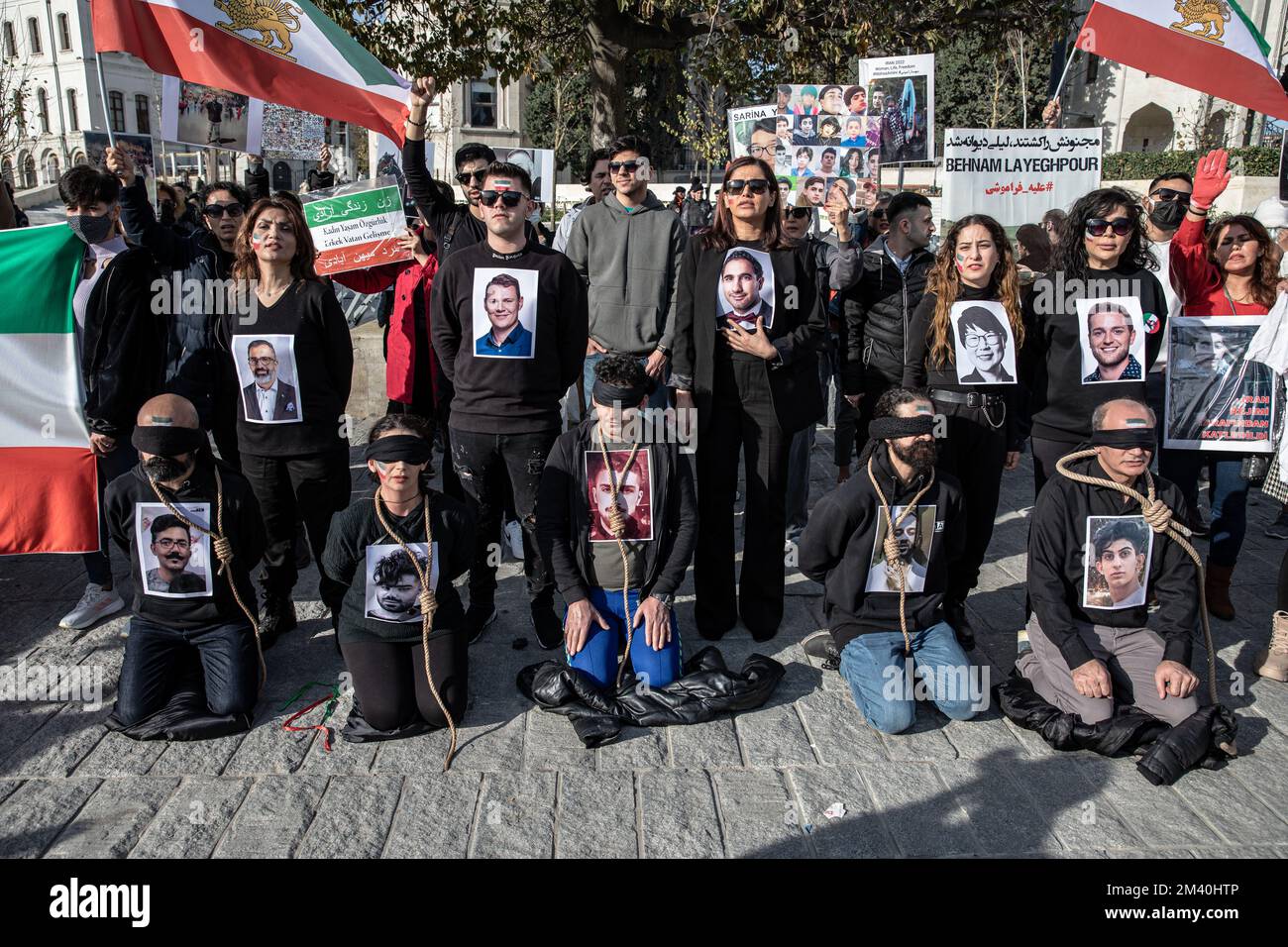 Istanbul, Turkey. 17th Dec, 2022. Protesters perform an execution scene ...