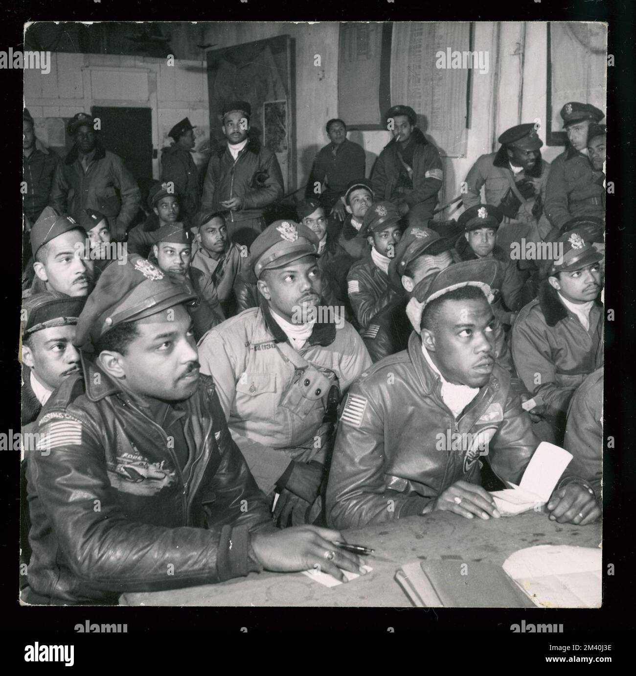 Members of the Army Air Force 332nd Fighter Group in a briefing room ...