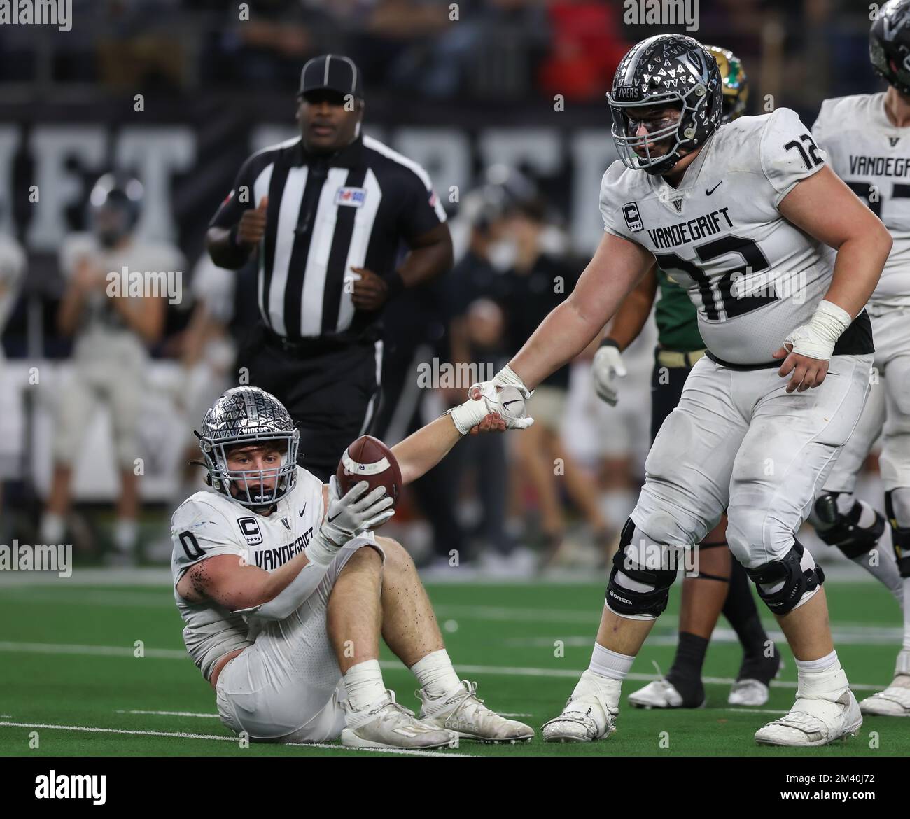 Dallas, TX, USA. 17th Dec, 2022. Vandegrift's Alex Witt #0 is helped up ...