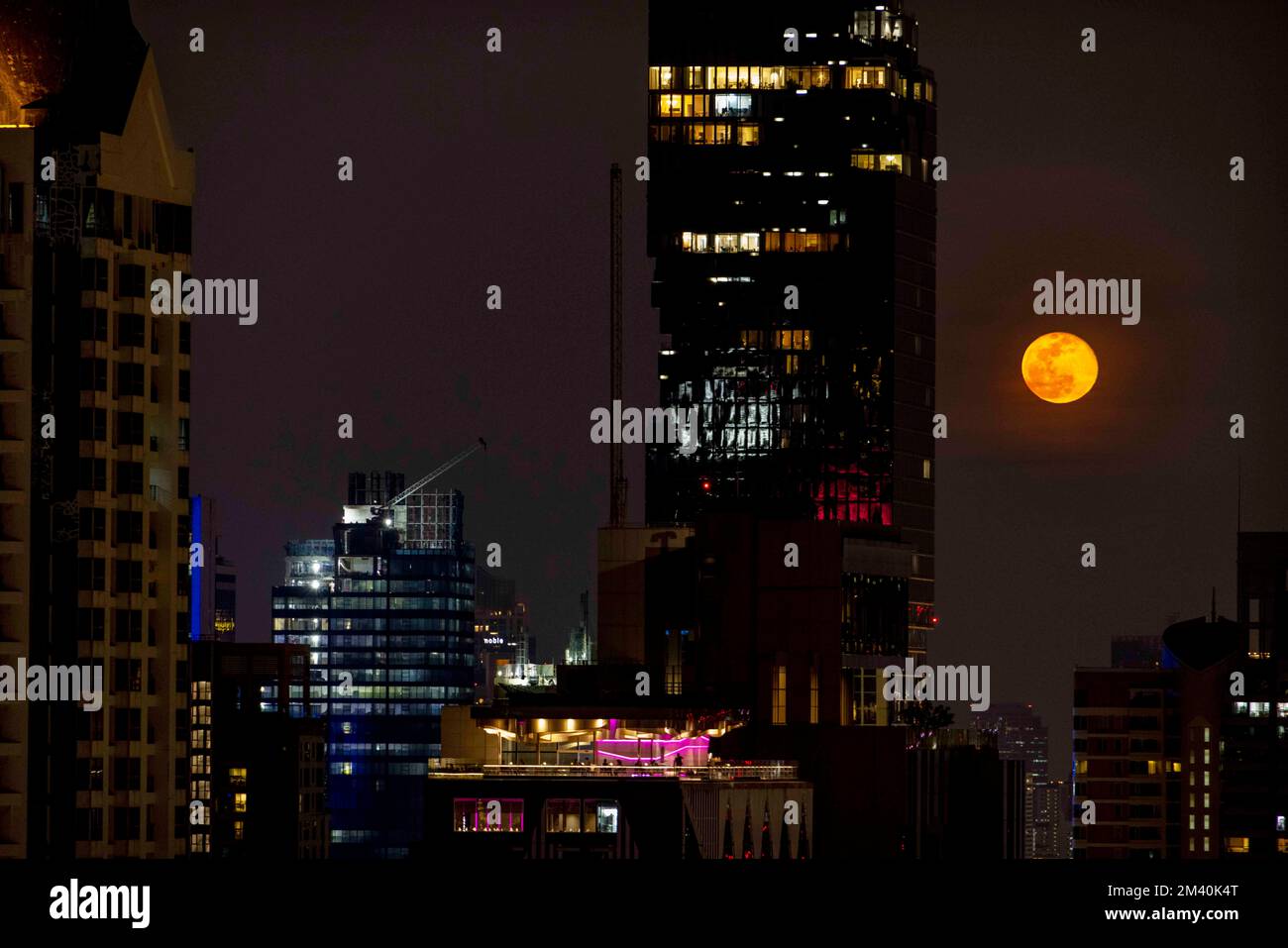 pic shows: “Cold Moon” - Moon rise over Mahanakhon building, Bangkok in ...
