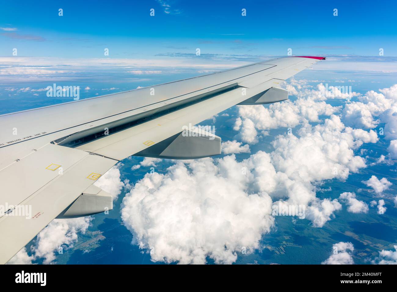 View from the airplane window at a beautiful cloudy sky and the ...