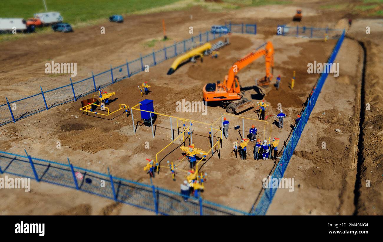 Aerial view excavator and construction workers working on construction ...