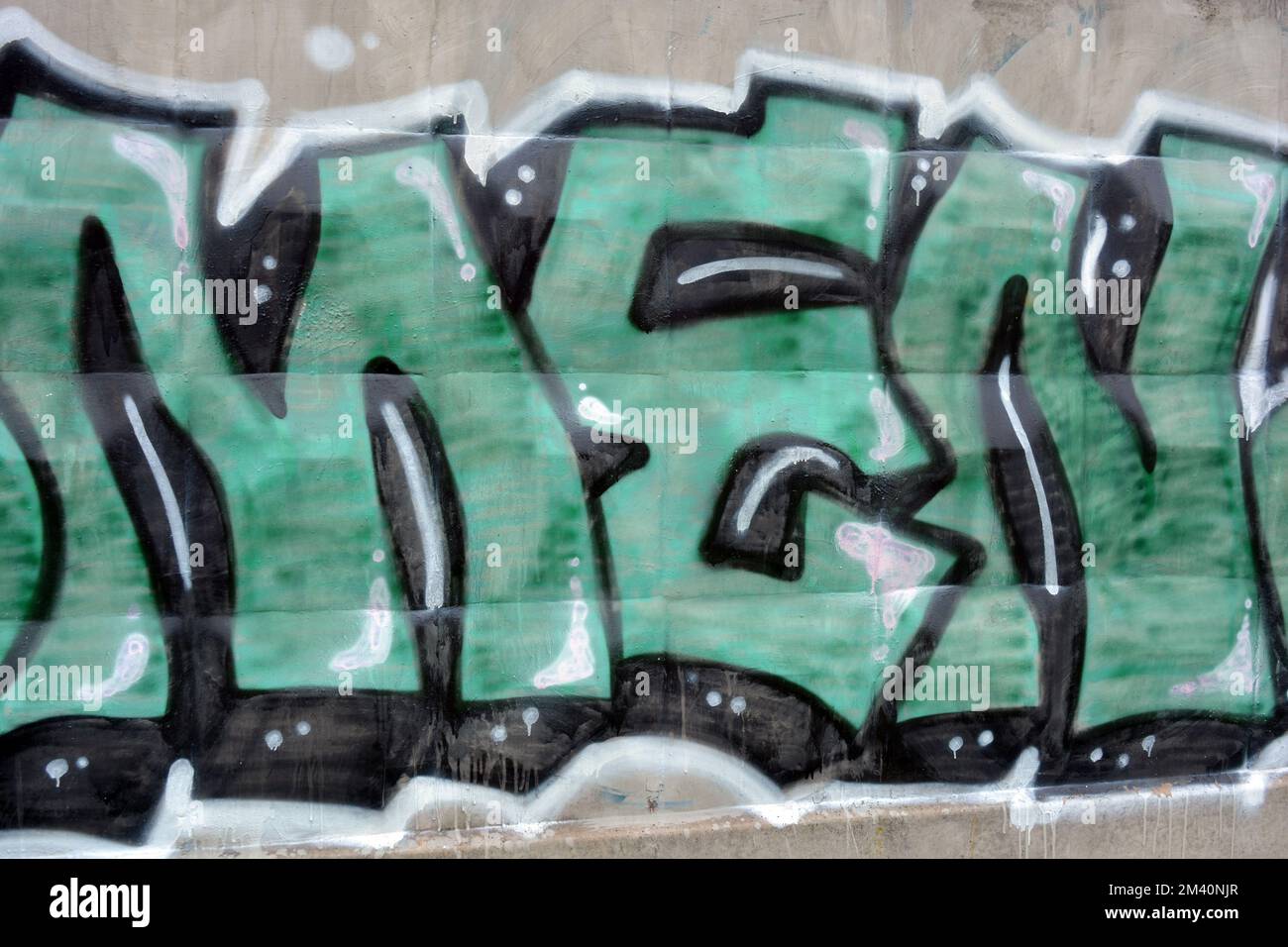 Graffiti word OMEN! Drawn by a lapdog in voluminous green letters with ...