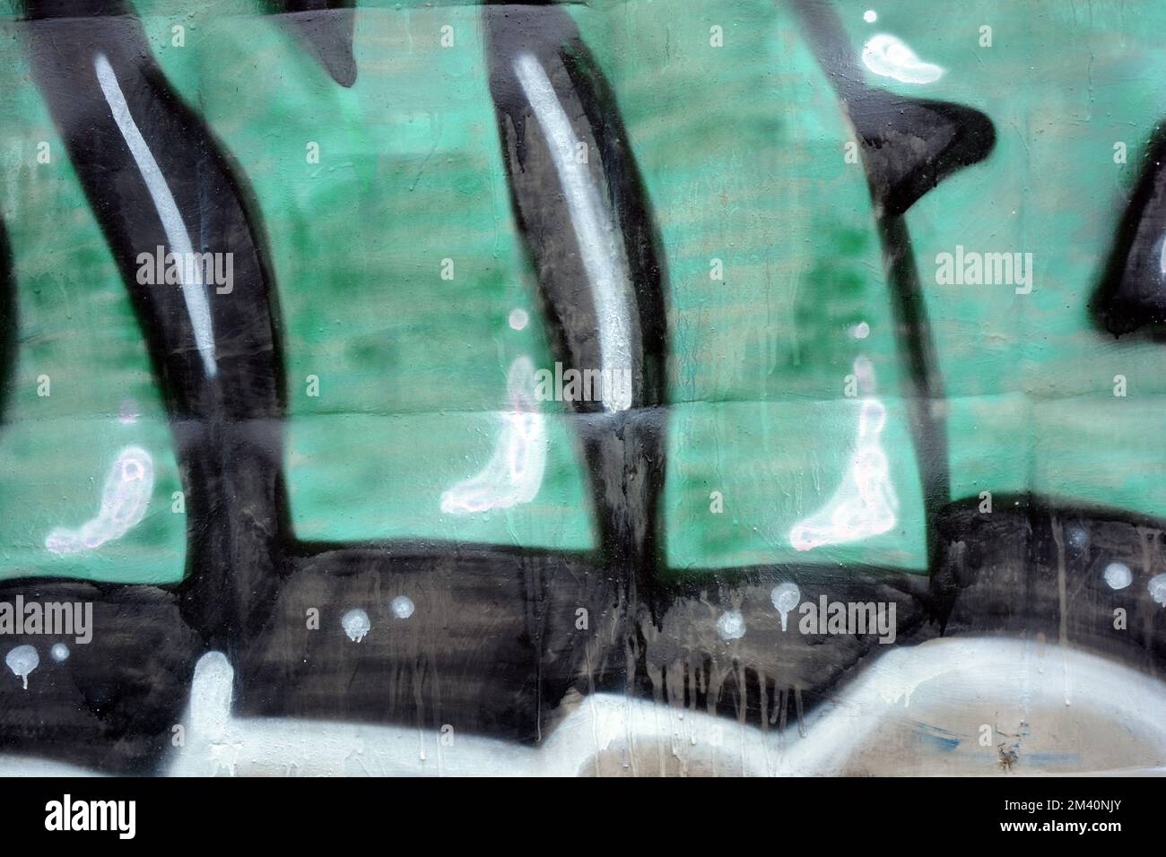 Graffiti word OMEN! Drawn by a lapdog in voluminous green letters with ...