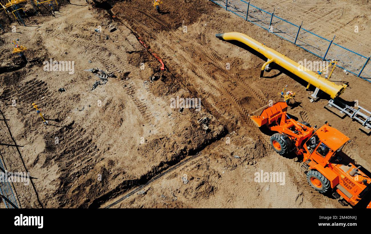 Aerial view excavator and construction workers working on construction ...