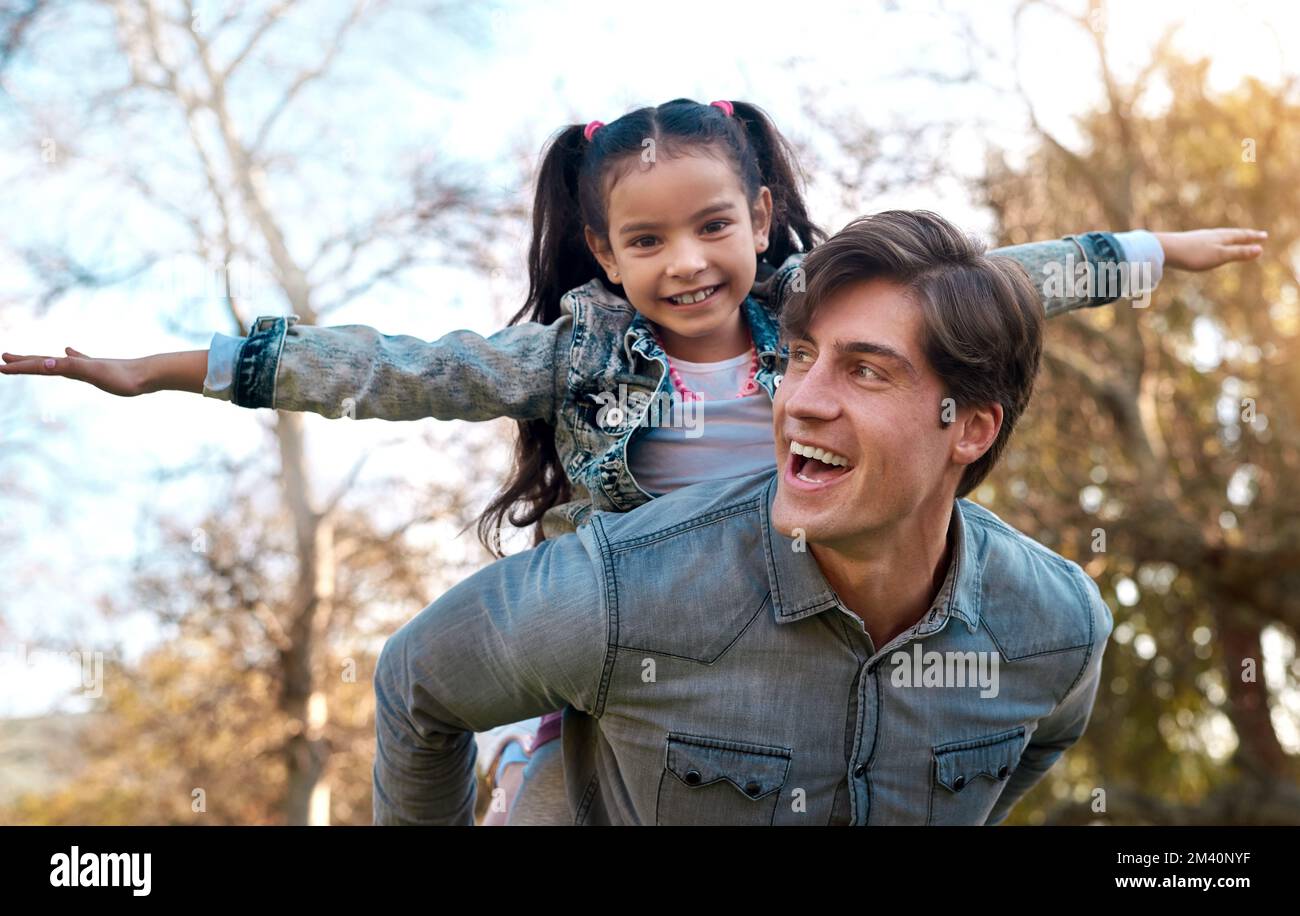 Lets fly to the moon and back. an adorable little girl enjoying a ...