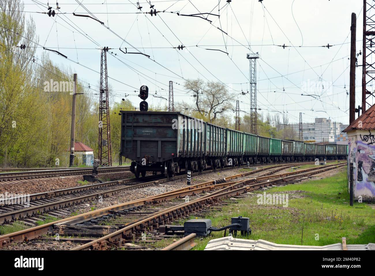 Heavy industry, heavy freight railway loading metal wagons pass along ...