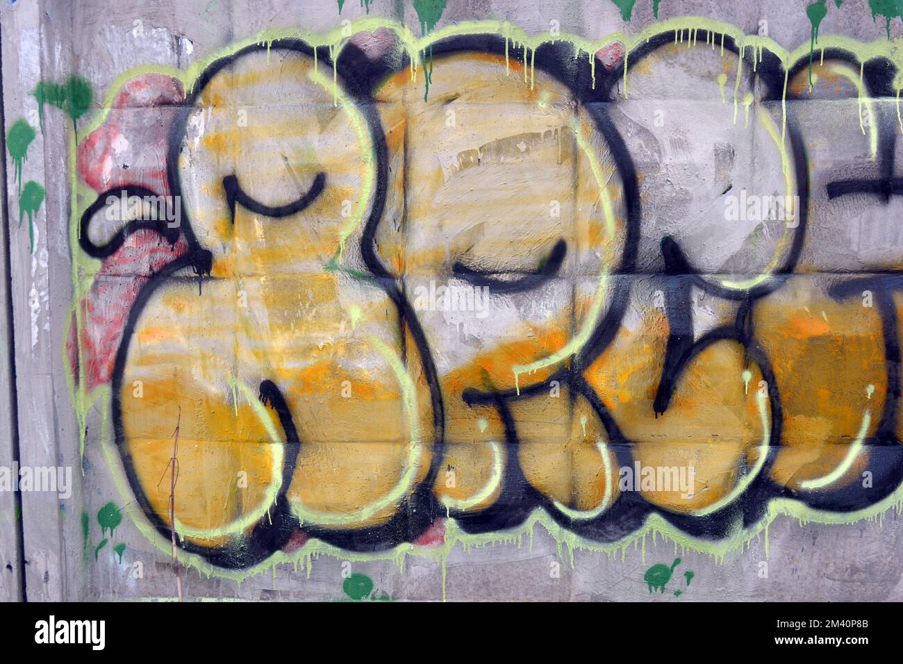 Graffiti word ARCHI OMEN, drawn by a lapdog in white, yellow letters ...