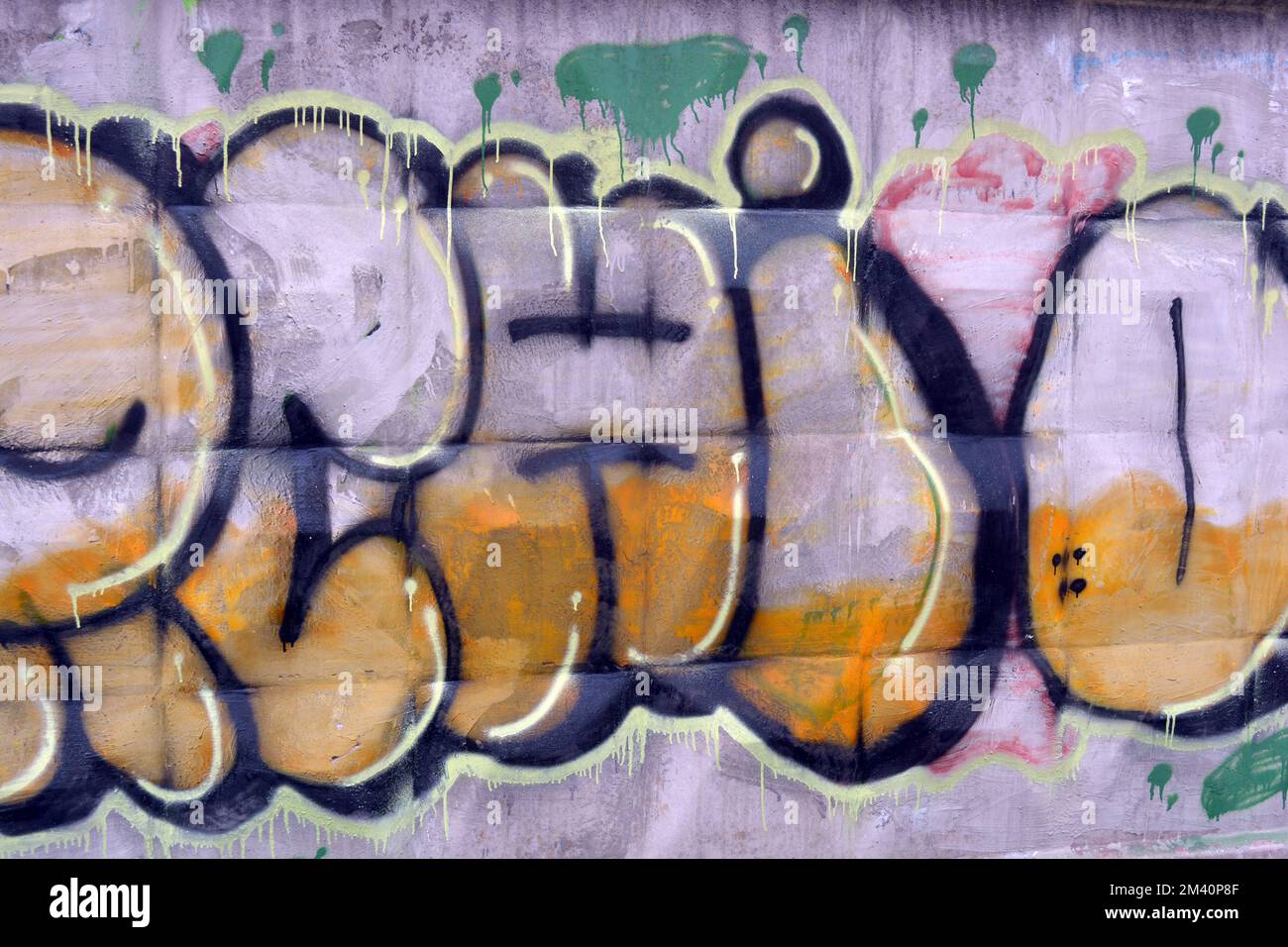 Graffiti word ARCHI OMEN, drawn by a lapdog in white, yellow letters ...