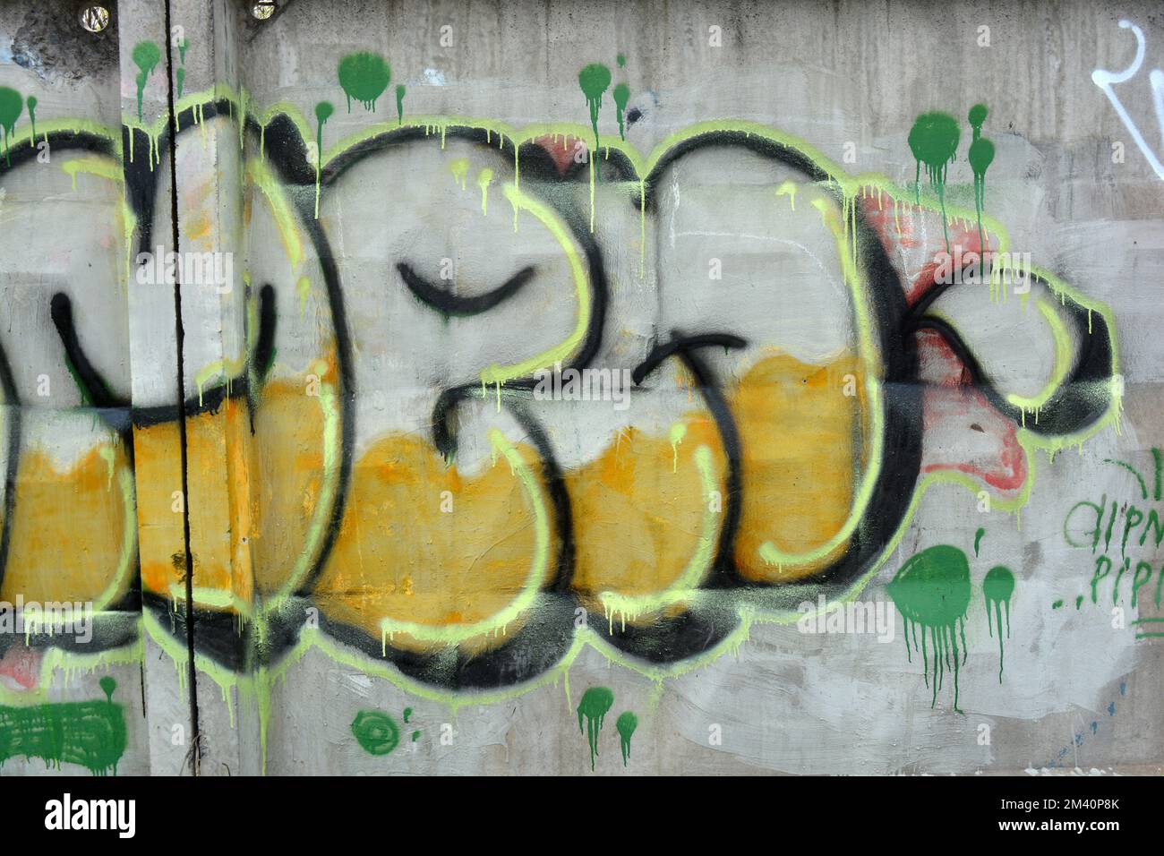 Graffiti word ARCHI OMEN, drawn by a lapdog in white, yellow letters ...