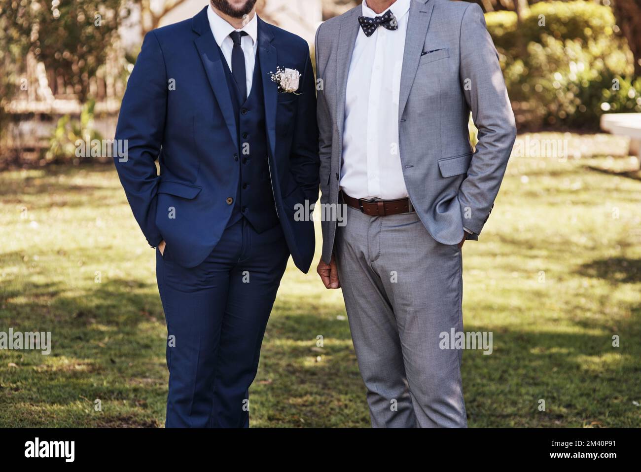 The groom and his father are both dressed for the occasion. an ...