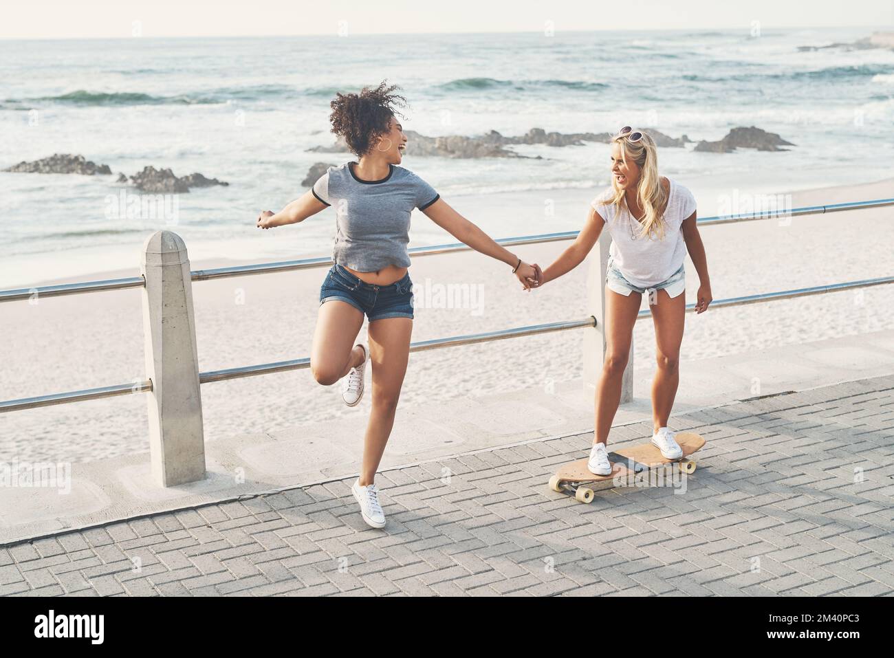 Friends know just how to cheer you up. a woman pulling her friend on a ...