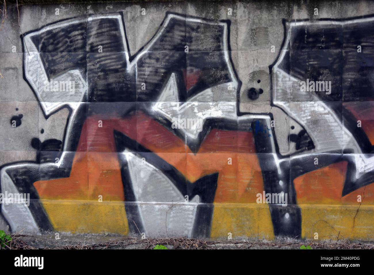 Graffiti word KS, drawn by a lapdog in grey, black and onange letters ...