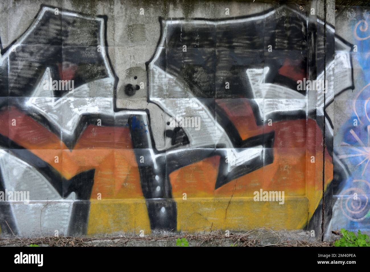 Graffiti word KS, drawn by a lapdog in grey, black and onange letters ...