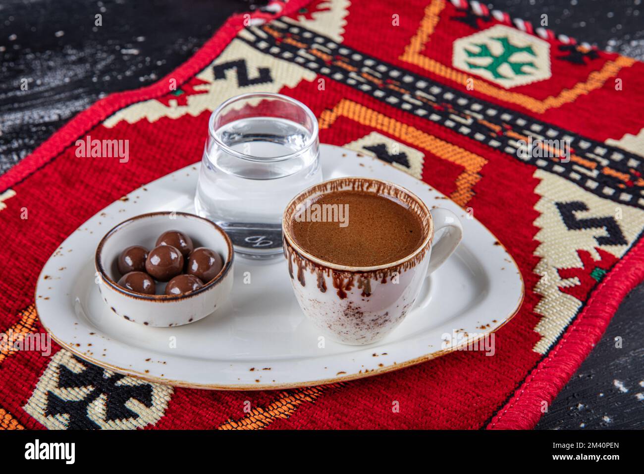 Traditional Turkish coffee in porcelain cup on wooden table. Anatolian ...