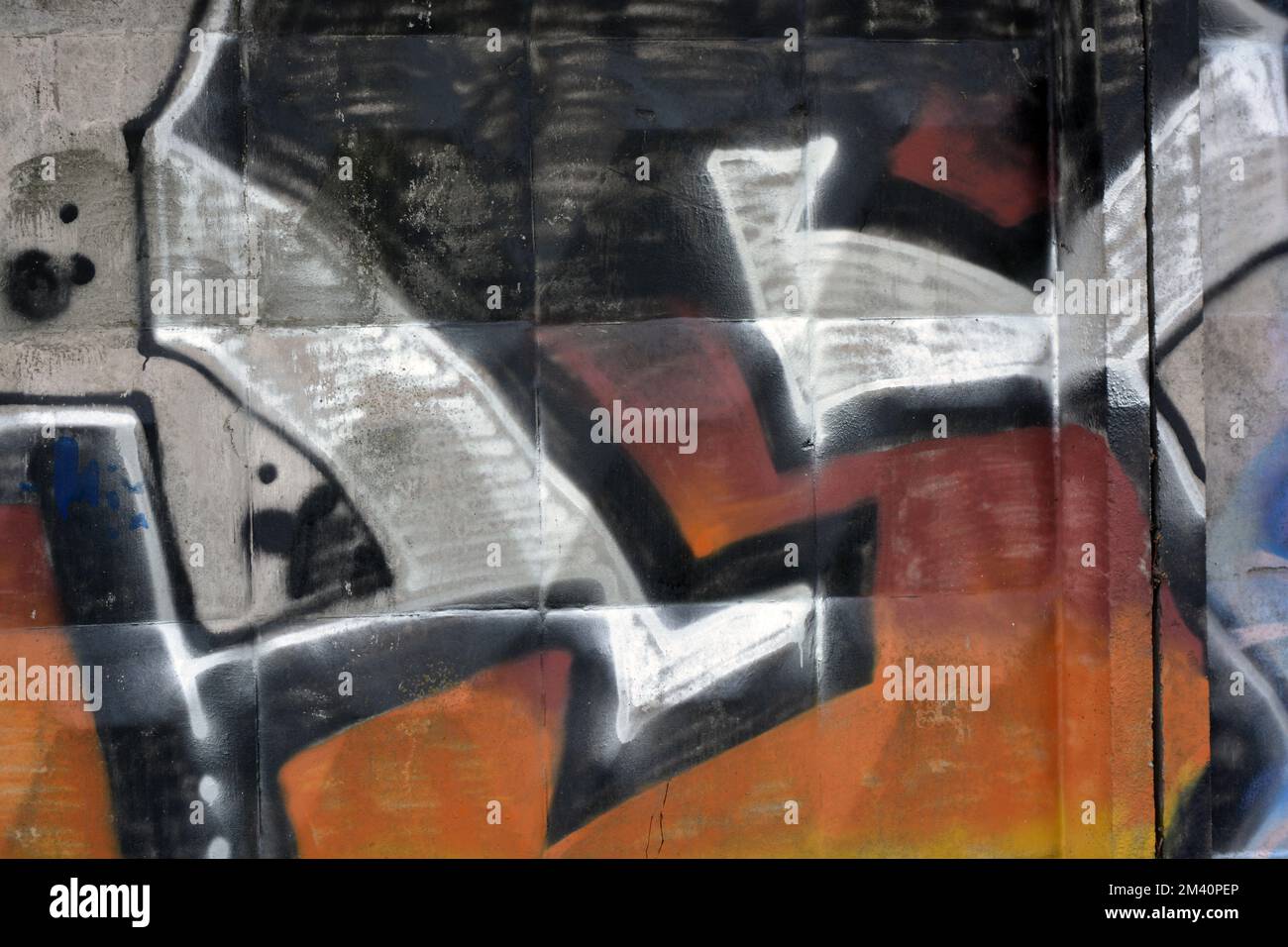 Graffiti word KS, drawn by a lapdog in grey, black and onange letters ...