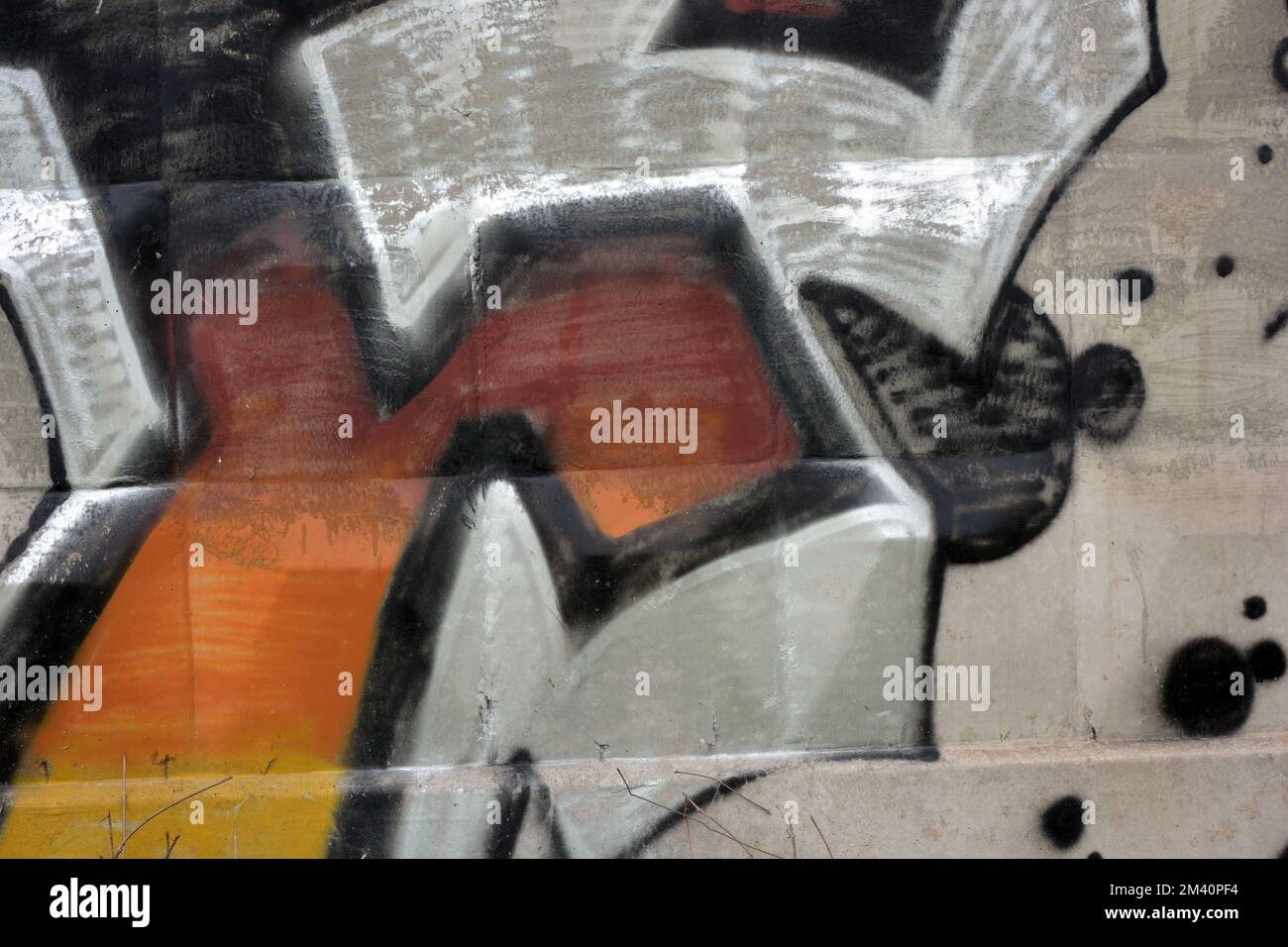 Graffiti word F, drawn by a lapdog in grey, black and onange letters ...