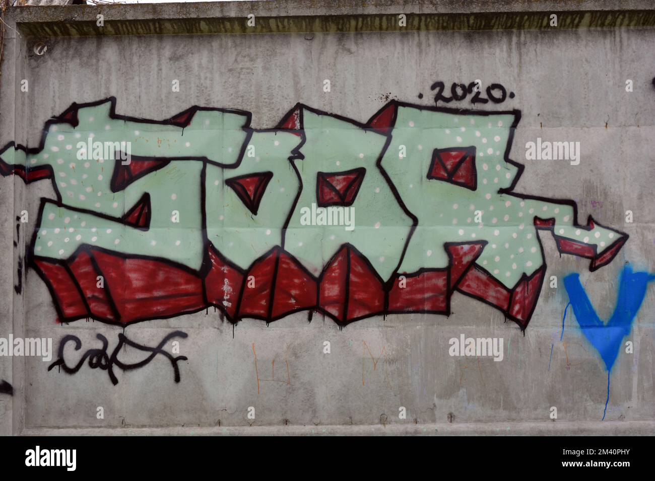Graffiti word SOOR, drawn by a lapdog in sky blue, cyan, blue with red ...