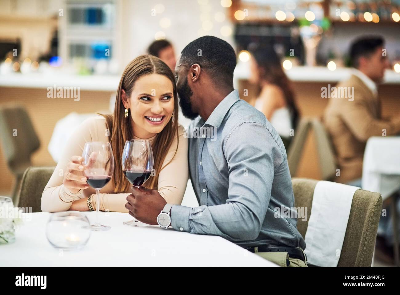 I Think We Should Book A Hotel Room An Affectionate Young Man Whispering Into His Girlfriends