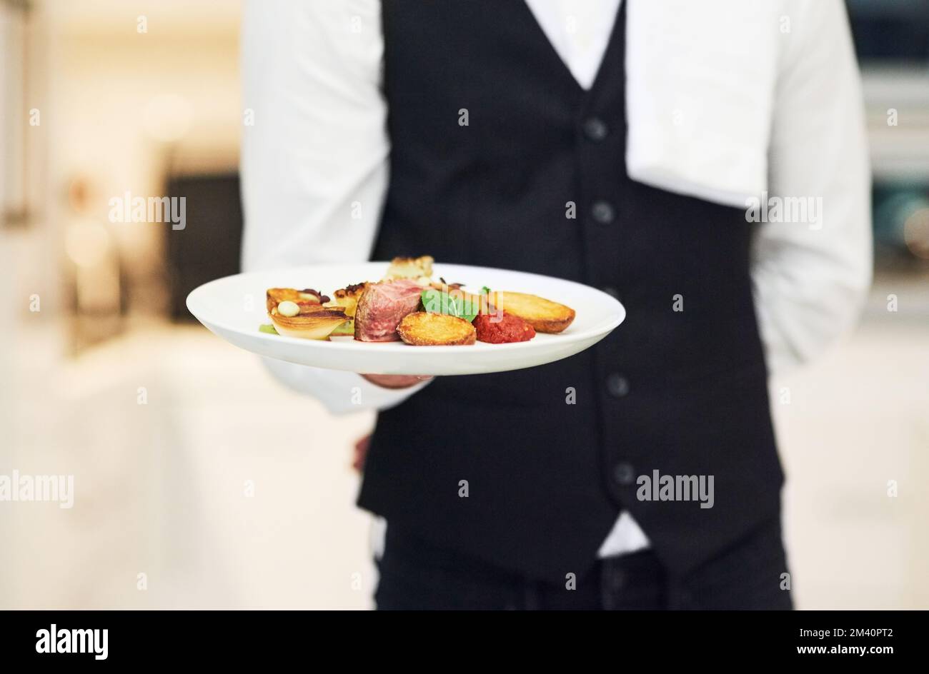 We prepare the best meals in town. an unrecognizable young waiter ...