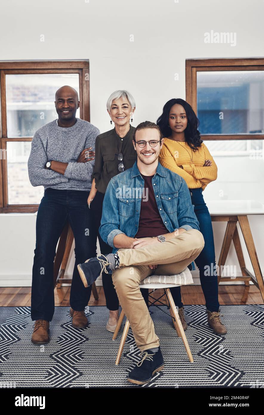 The whole team all together again. Portrait of a group of confident ...