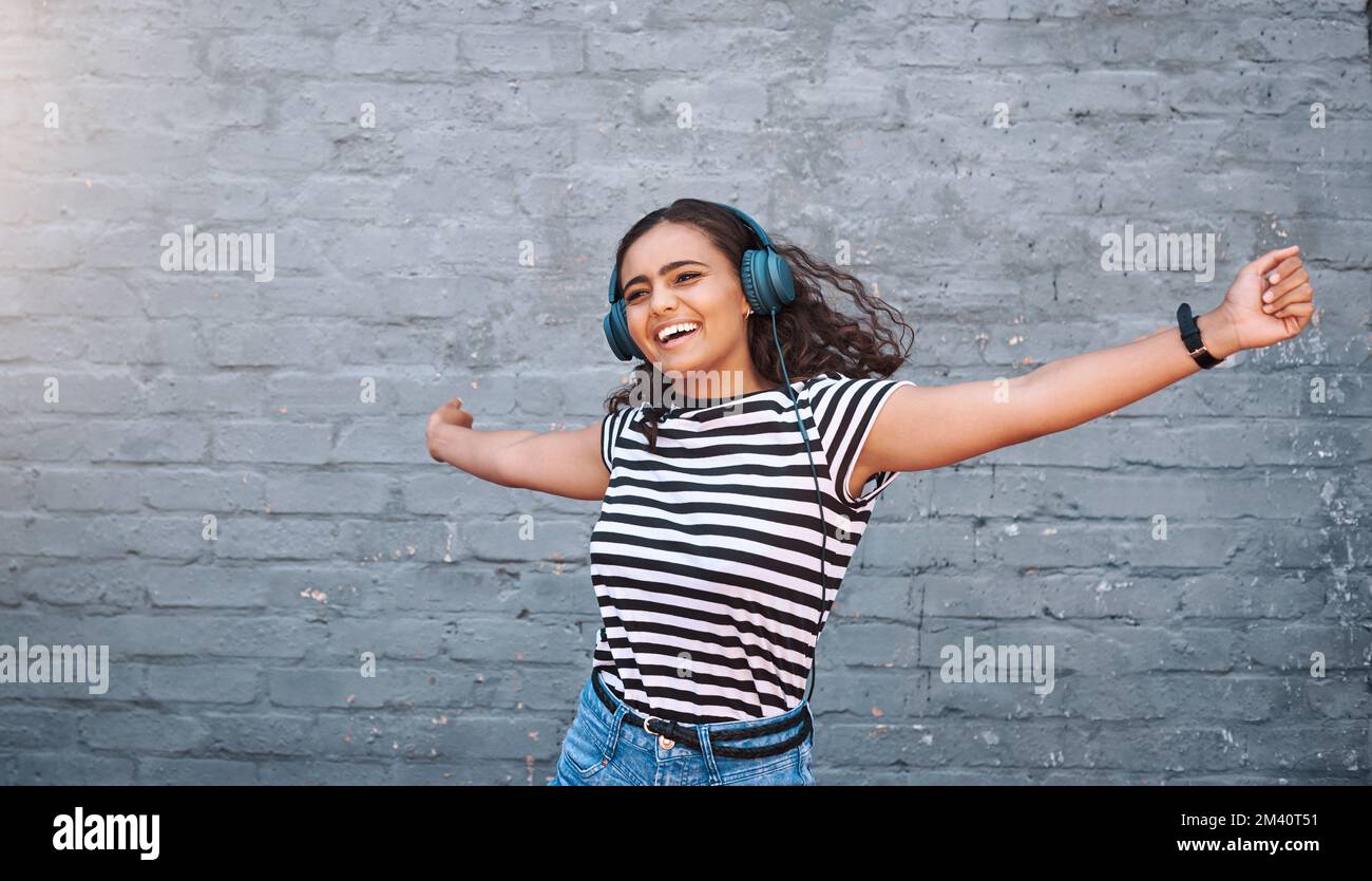 When the beat gets you, go with it. a young woman dancing against a ...