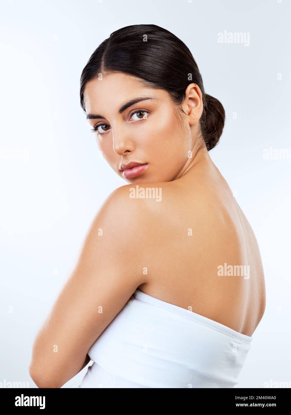 Turning my back on bad skincare habits. Studio shot of beautiful young ...