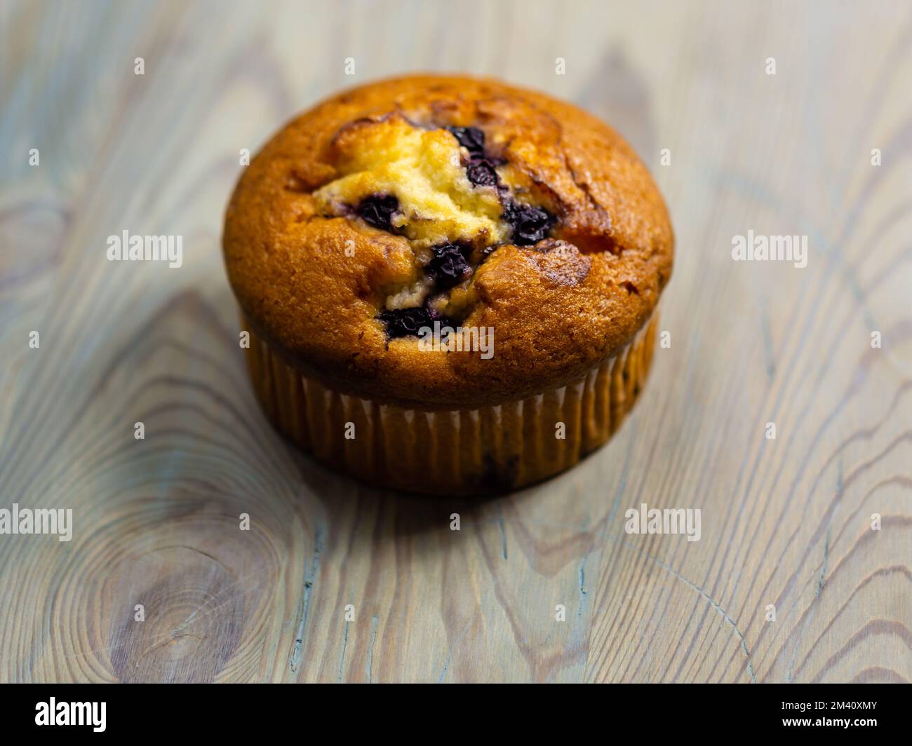 Blueberry muffin on rustic wooden background, closeup Stock Photo - Alamy